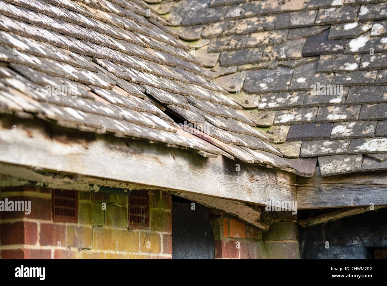 an old tiled roof damaged by recent storm weather Stock Photo - Alamy