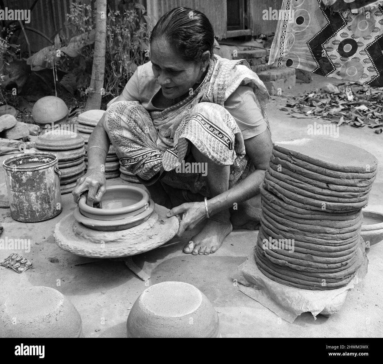 Best pottery work by woman,pottery making With clay Stock Photo - Alamy