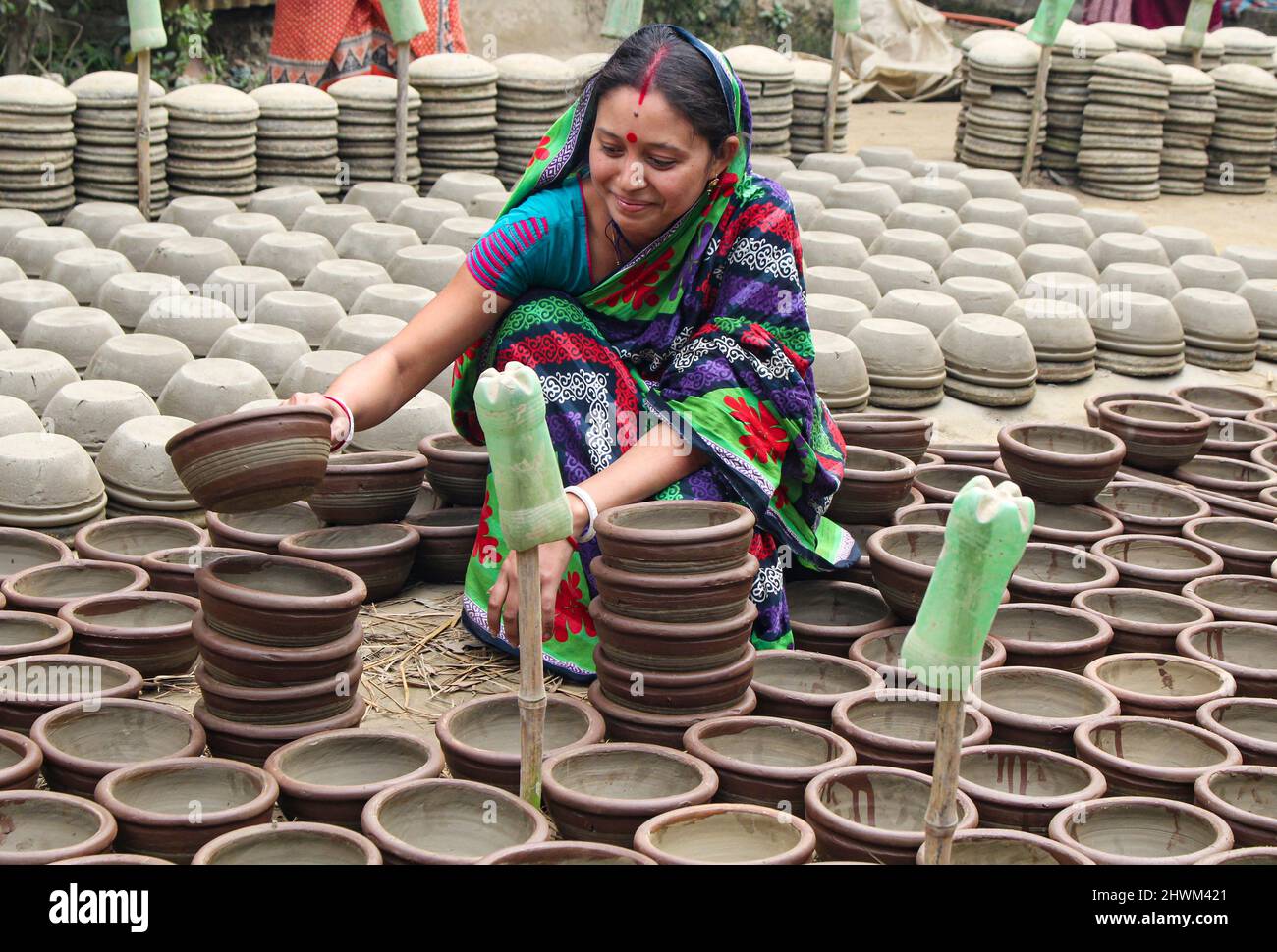 Best pottery work by woman,pottery making With clay Stock Photo - Alamy