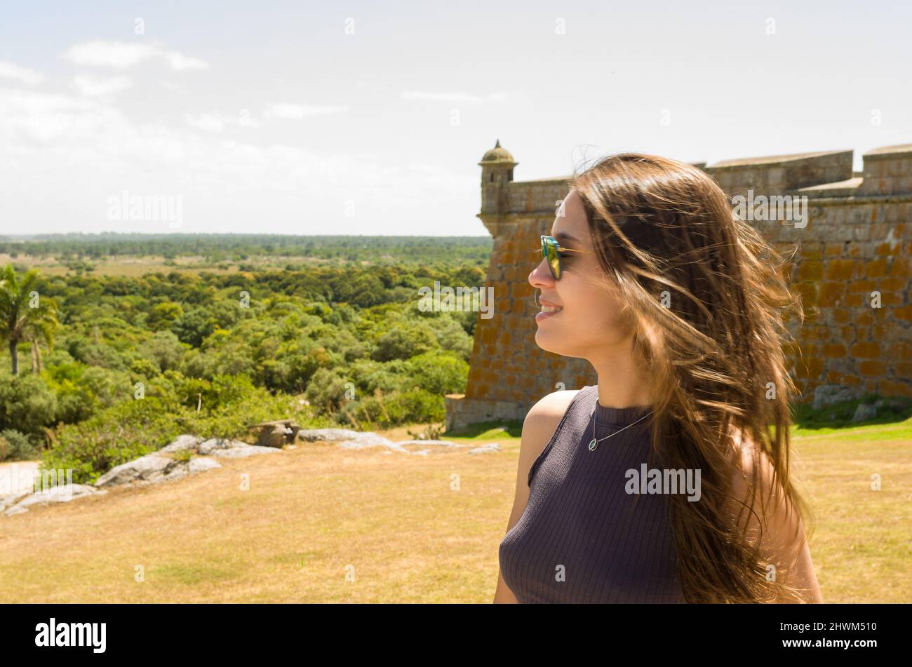 Young woman looking at Forte de Santa Tereza in Uruguay, important ...