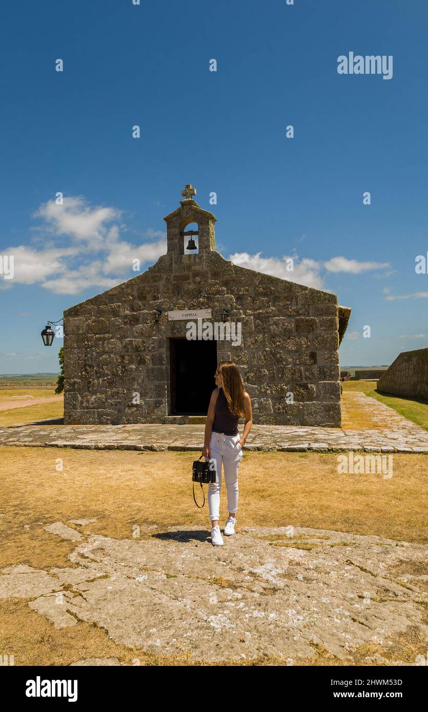 Female tourist visiting Forte de Santa Tereza in Uruguay, an important ...