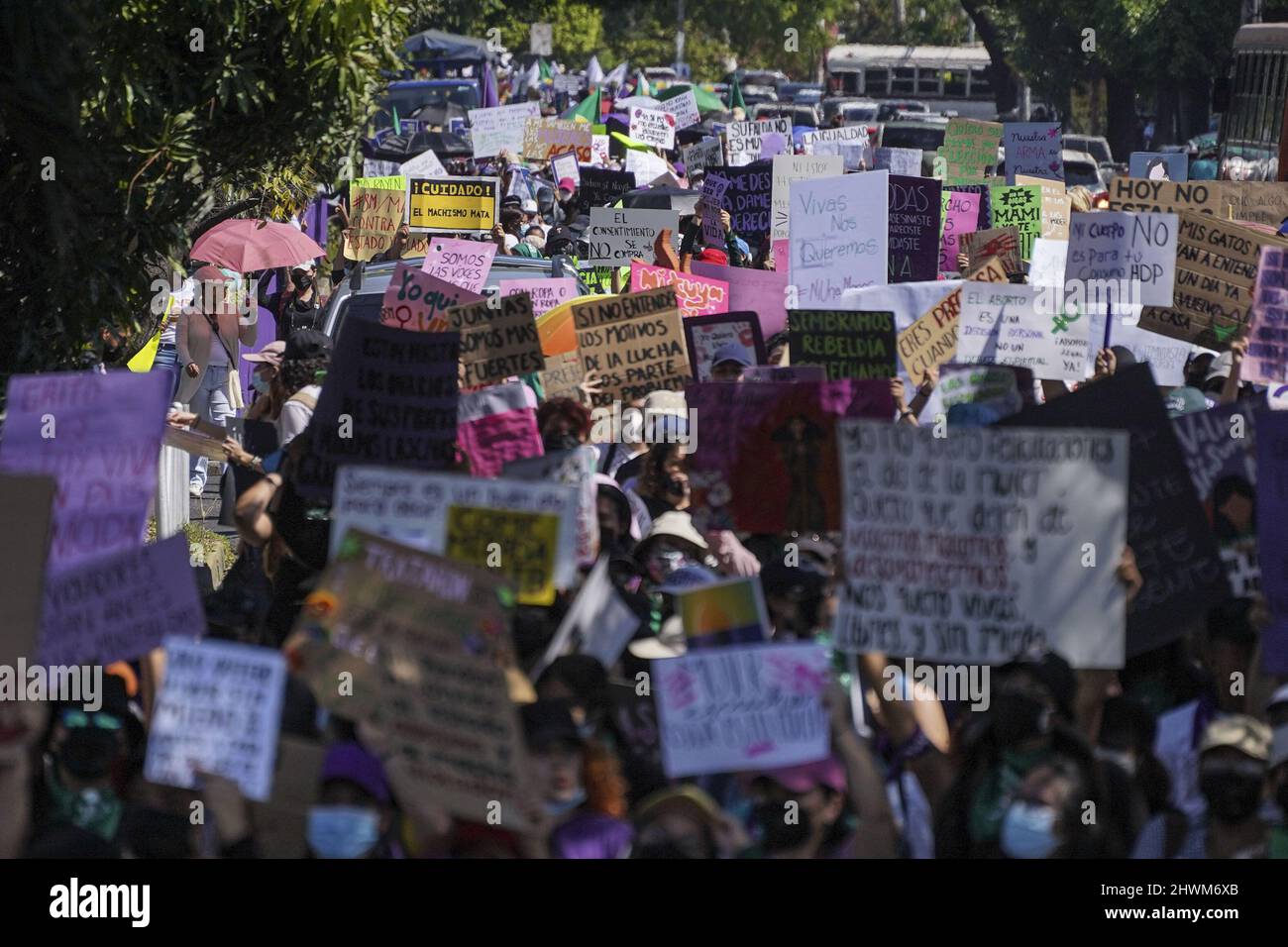 Female protesters carry signs and chant slogans during a protest prior ...