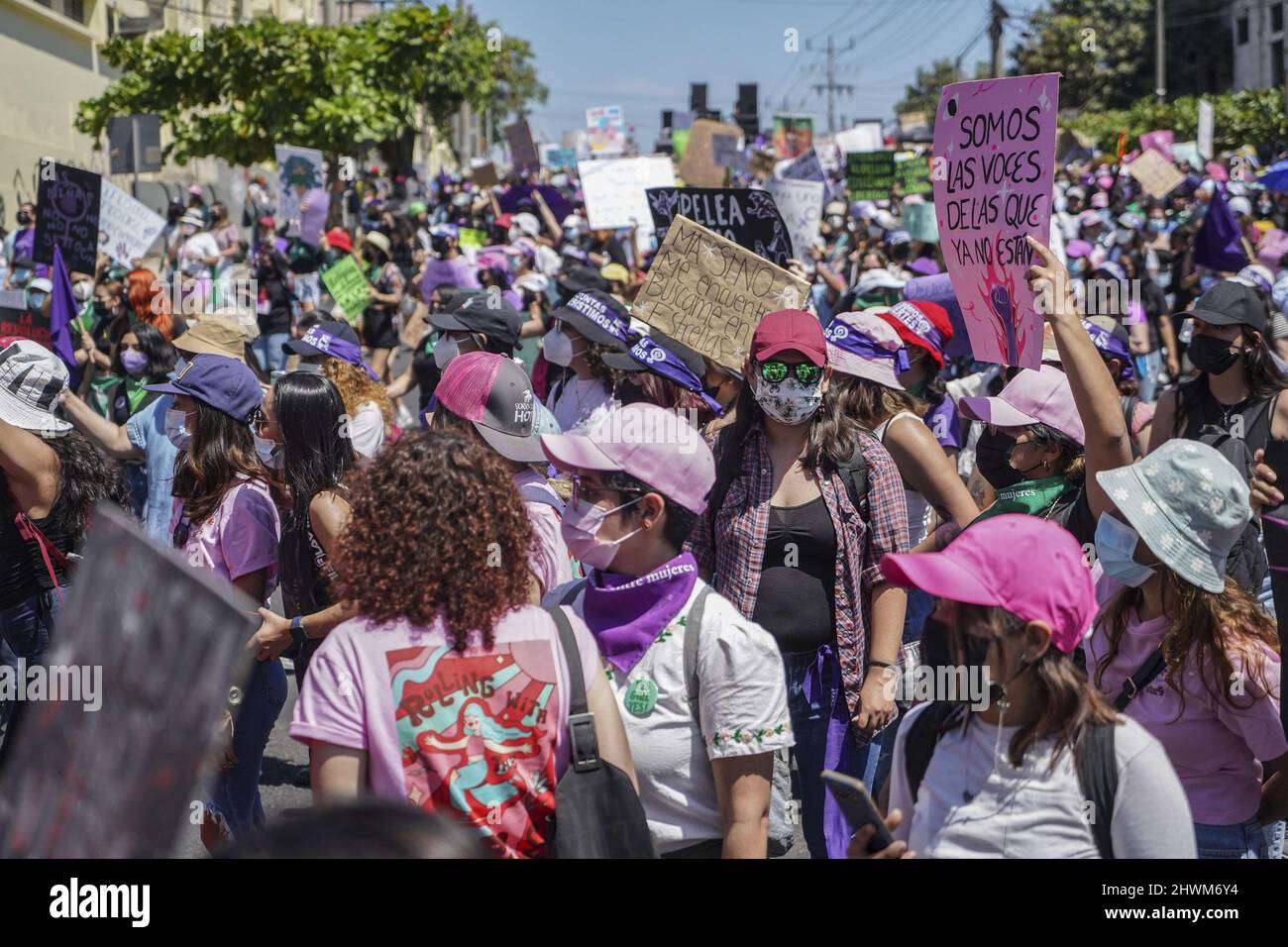 Female protesters carry signs and chant slogans during a protest prior ...
