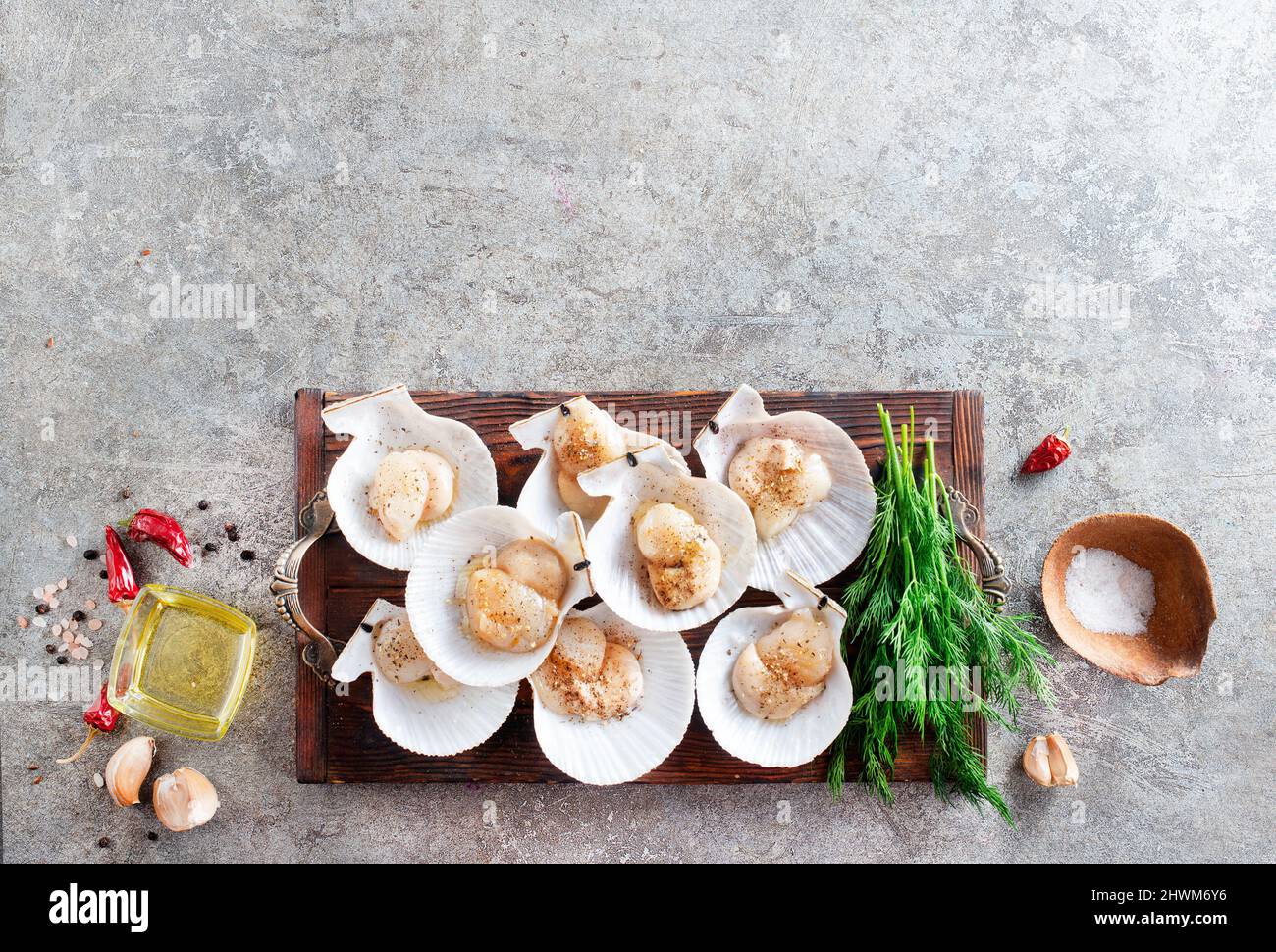 Raw scallops in shells on wooden tray. Mediterranean seafood. Fresh ...