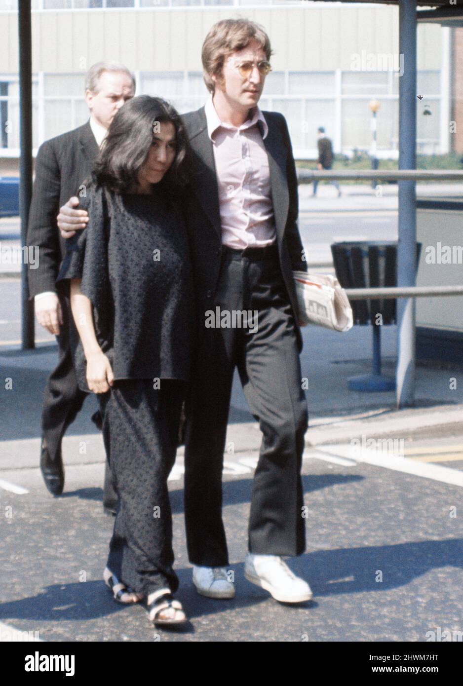 Former member of The Beatles pop group John Lennon with his wife Yoko Ono at Heathrow Airport ...