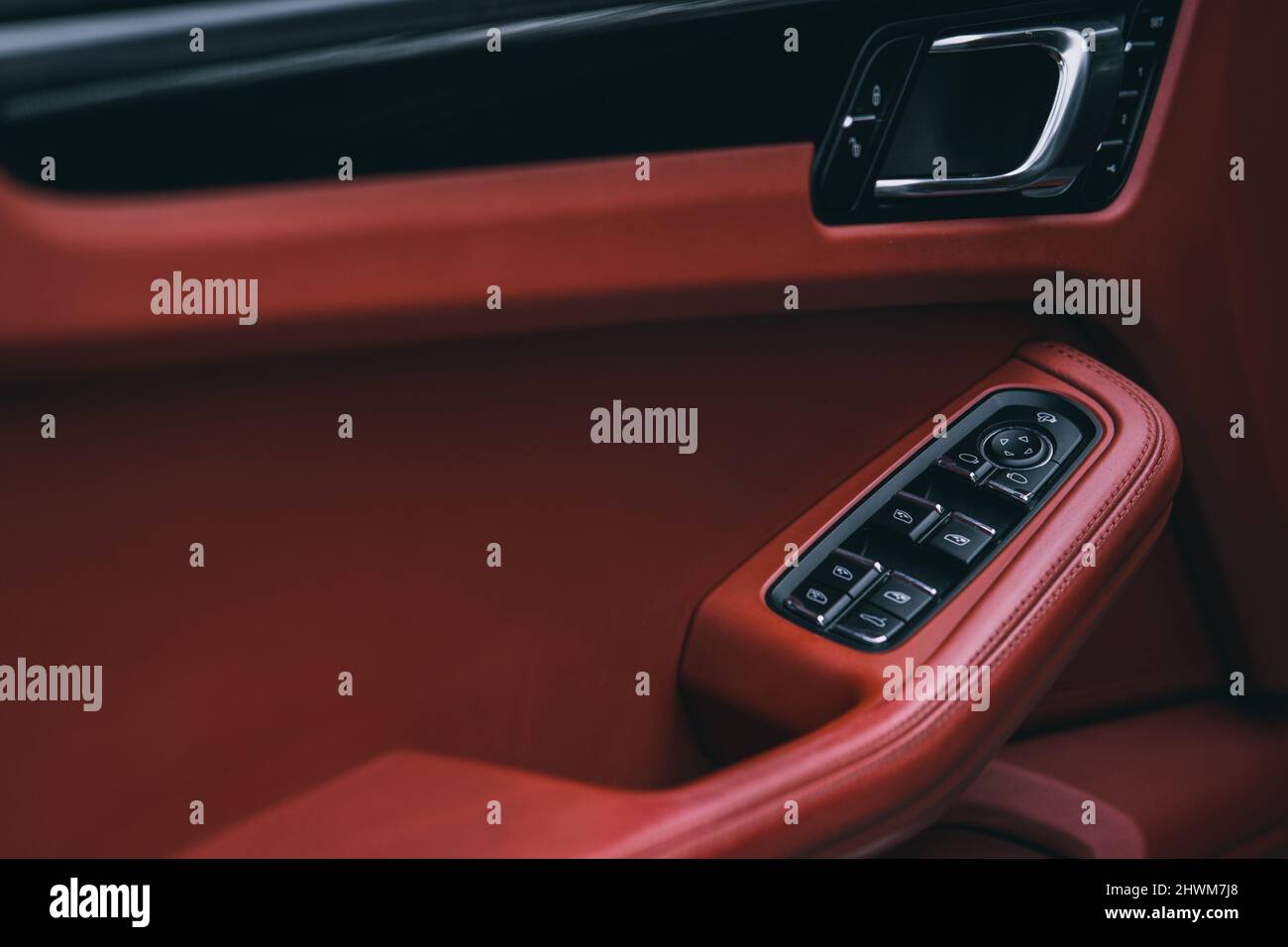 Interior of a driver door on a car. Visible controls for operating ...