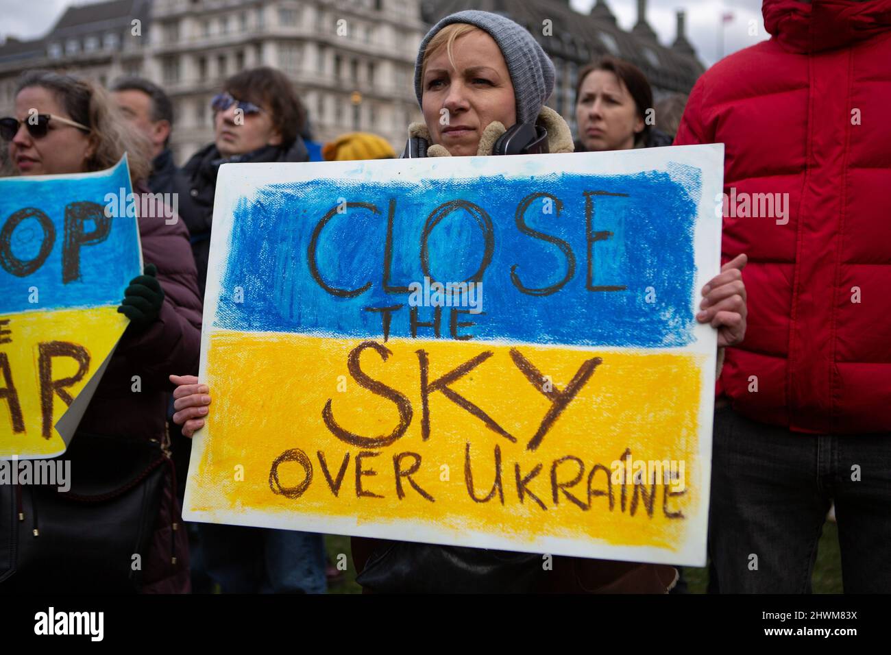 London, UK. 06th Mar, 2022. A protester holds a placard expressing her ...