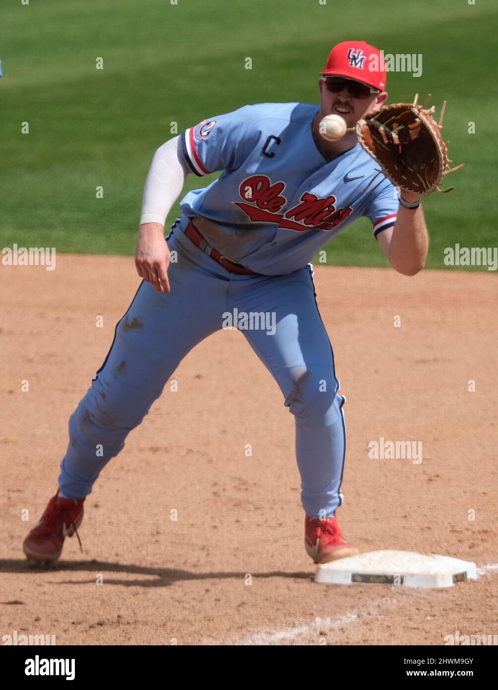 MARCH 06, 2022: Ole Miss First Baseman Tim Elko (#25) fields a ball at ...