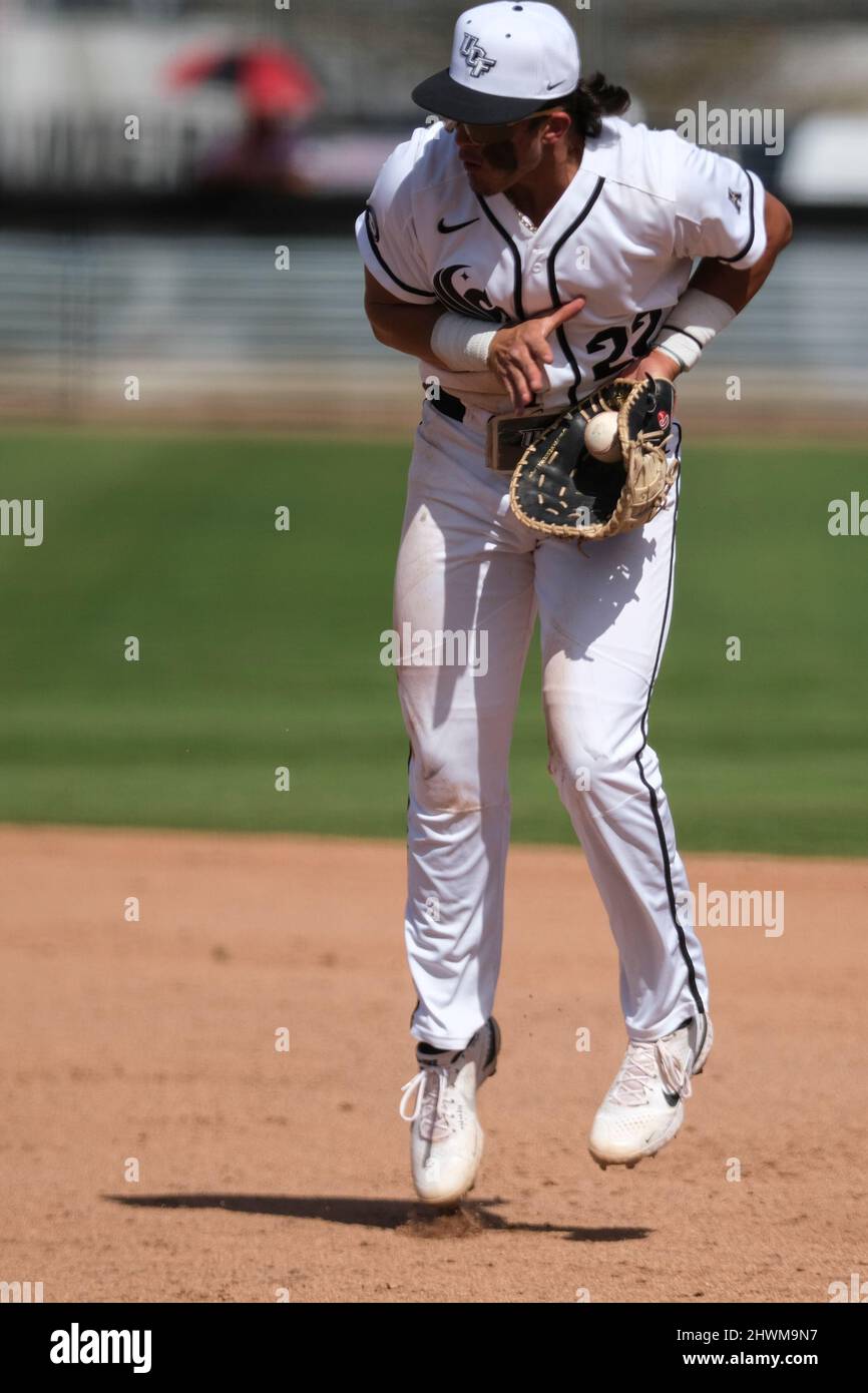 MARCH 06, 2022: UCF infielder Cole Russo (#22) fields a ball at first ...