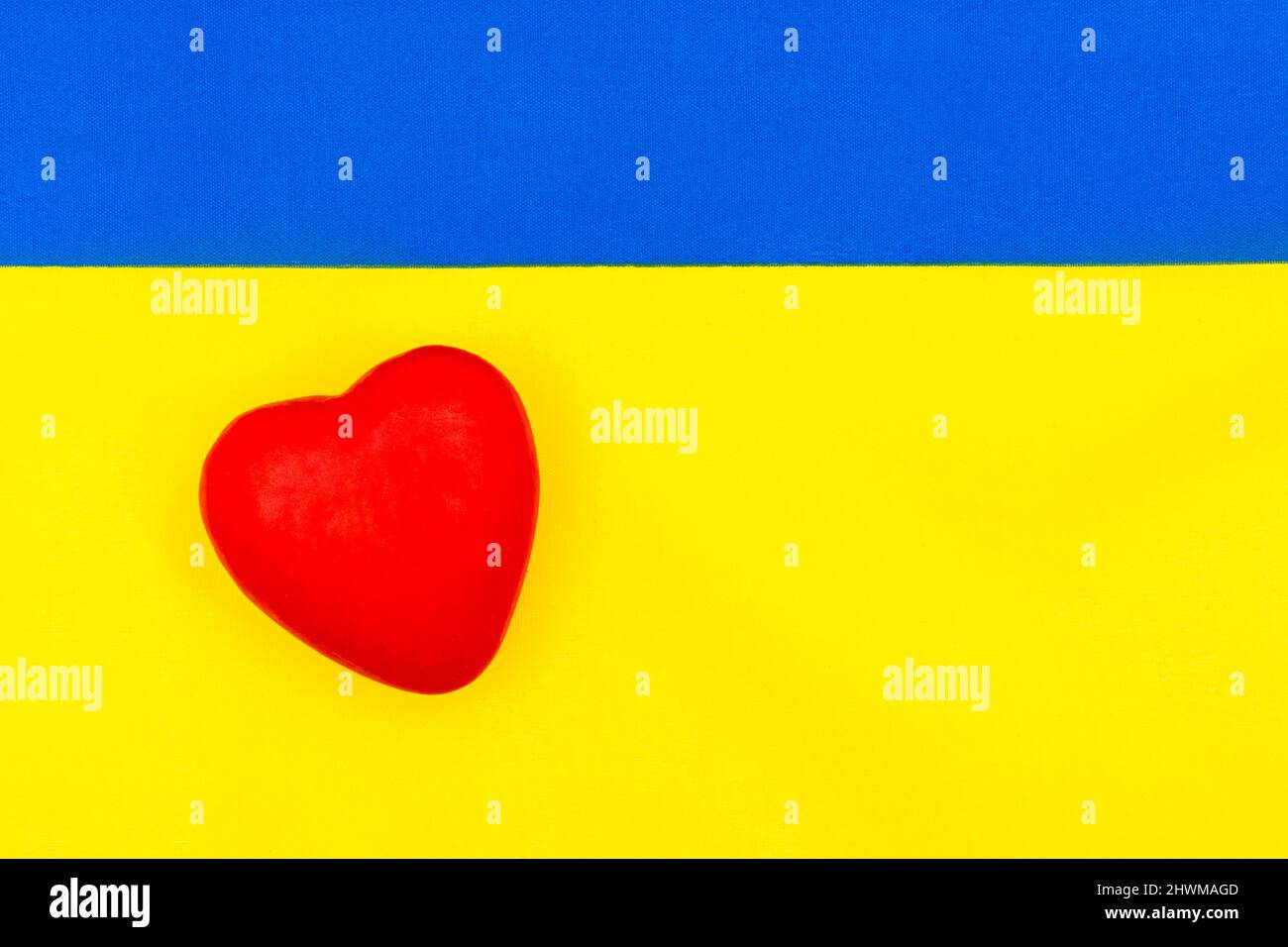 Blue and yellow Ukraine flag with heart shape. For support for Ukraine ...