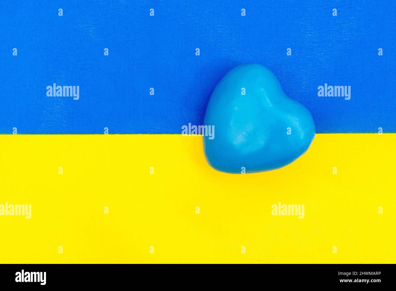 Blue and yellow Ukraine flag with heart shape. For support for Ukraine ...