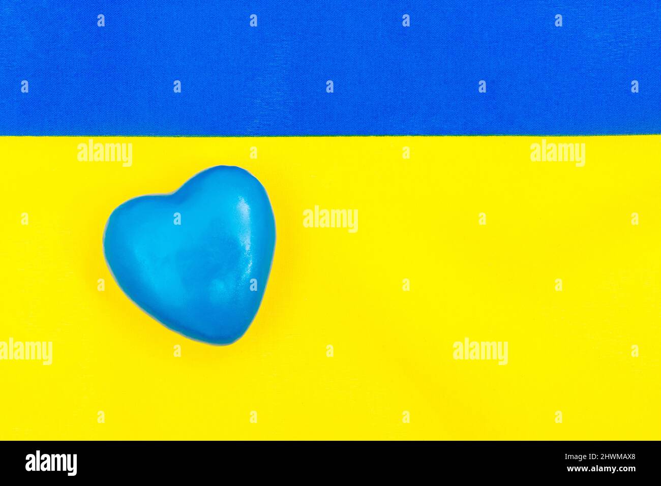 Blue and yellow Ukraine flag with heart shape. For support for Ukraine ...