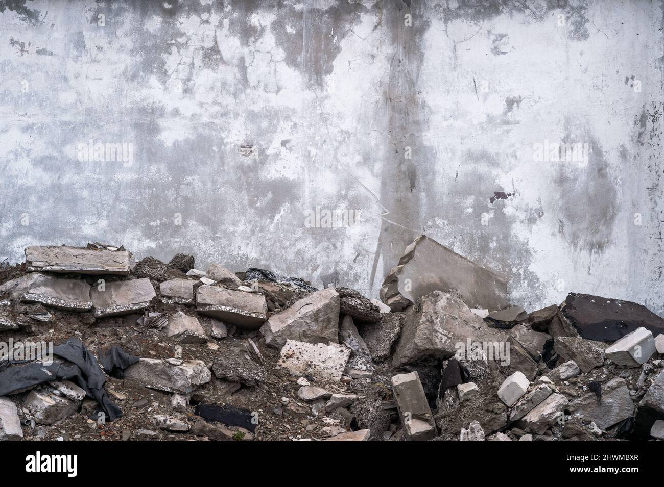 Construction waste in the form of a pile of concrete debris on the ...