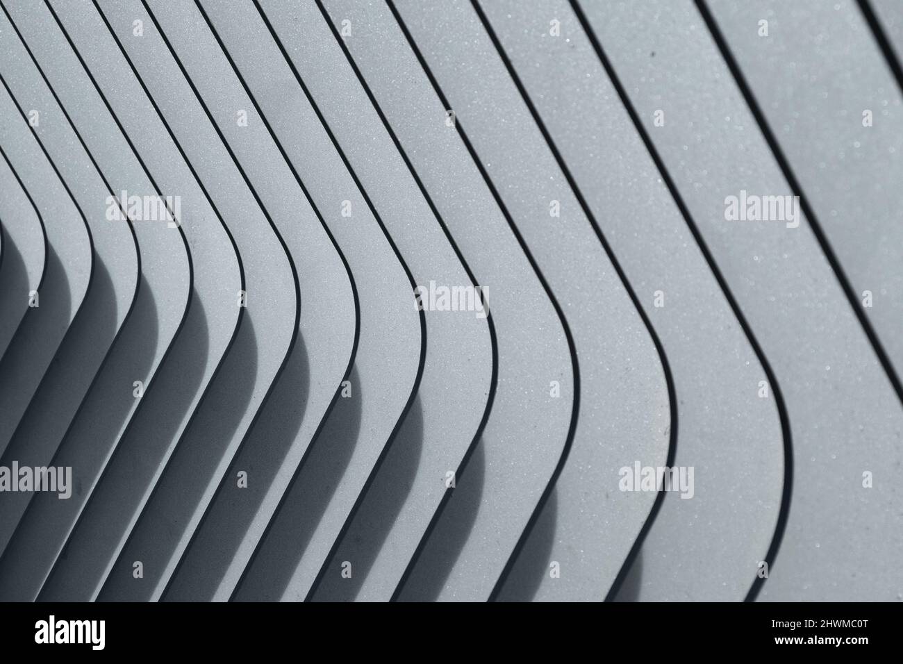 Abstract modern urban metal structure in a row with sun and shadow ...