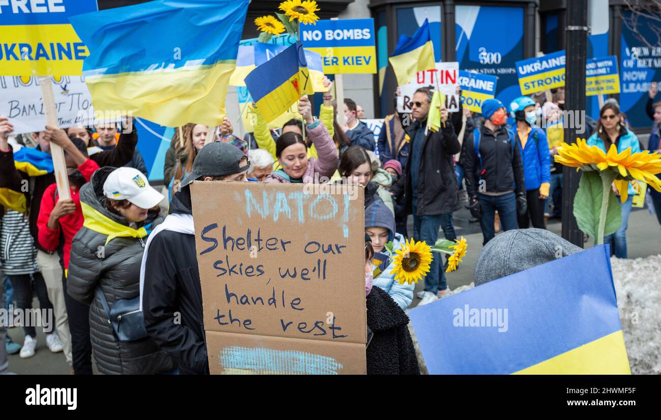 March 6, 2022. Boston, MA. People marched down Boylston Street in ...