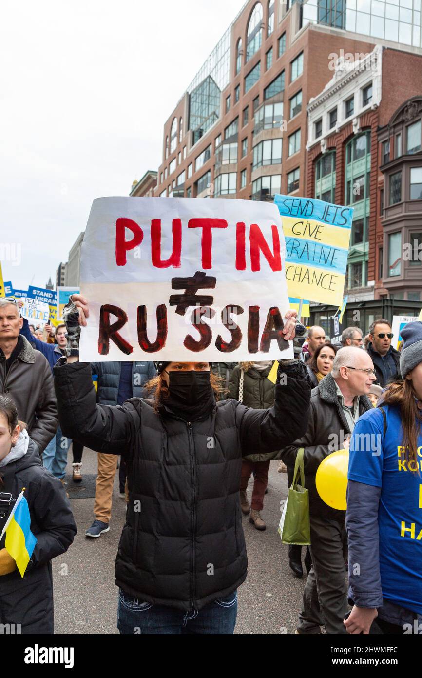 March 6, 2022. Boston, MA. People marched down Boylston Street in ...