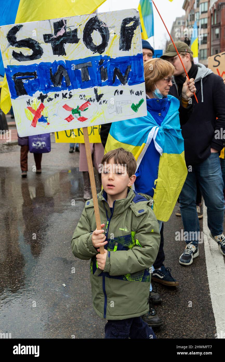 March 6, 2022. Boston, MA. People marched down Boylston Street in ...