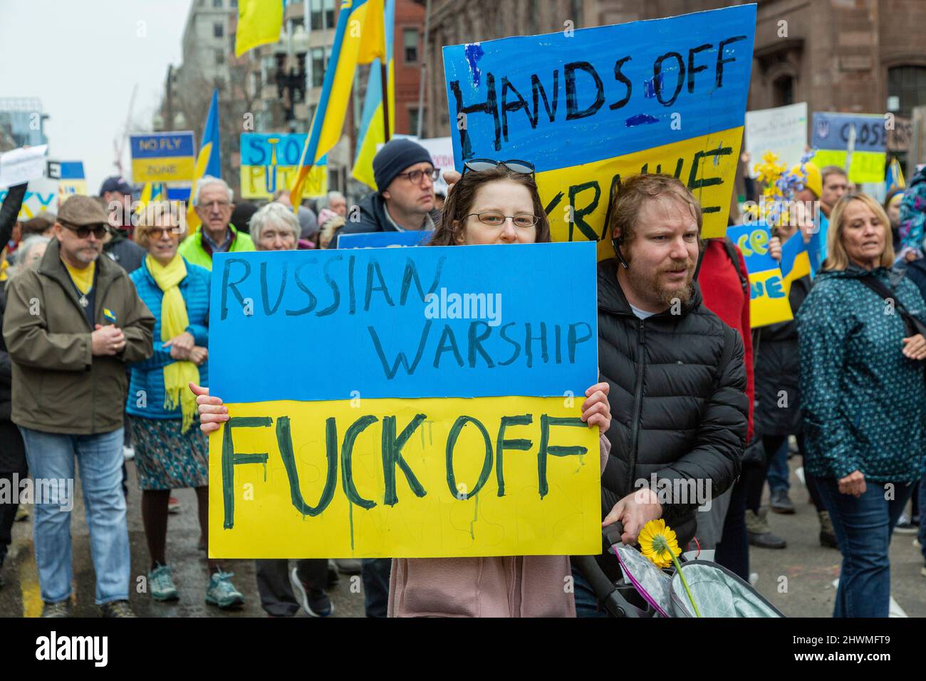 March 6, 2022. Boston, MA. People marched down Boylston Street in ...