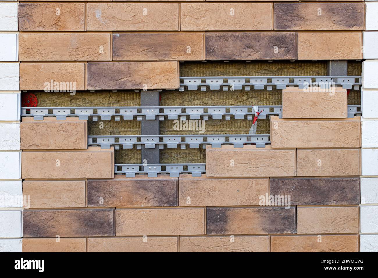 a fragment of a wall that is tiled with a break in it Stock Photo - Alamy