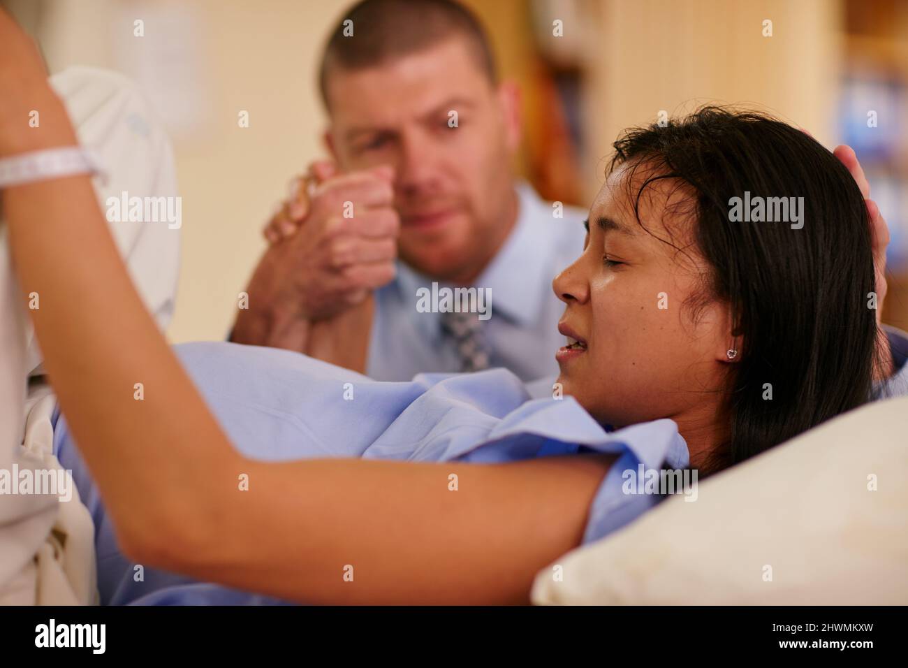 Its not pain, its power. Shot of a young woman giving birth with her ...