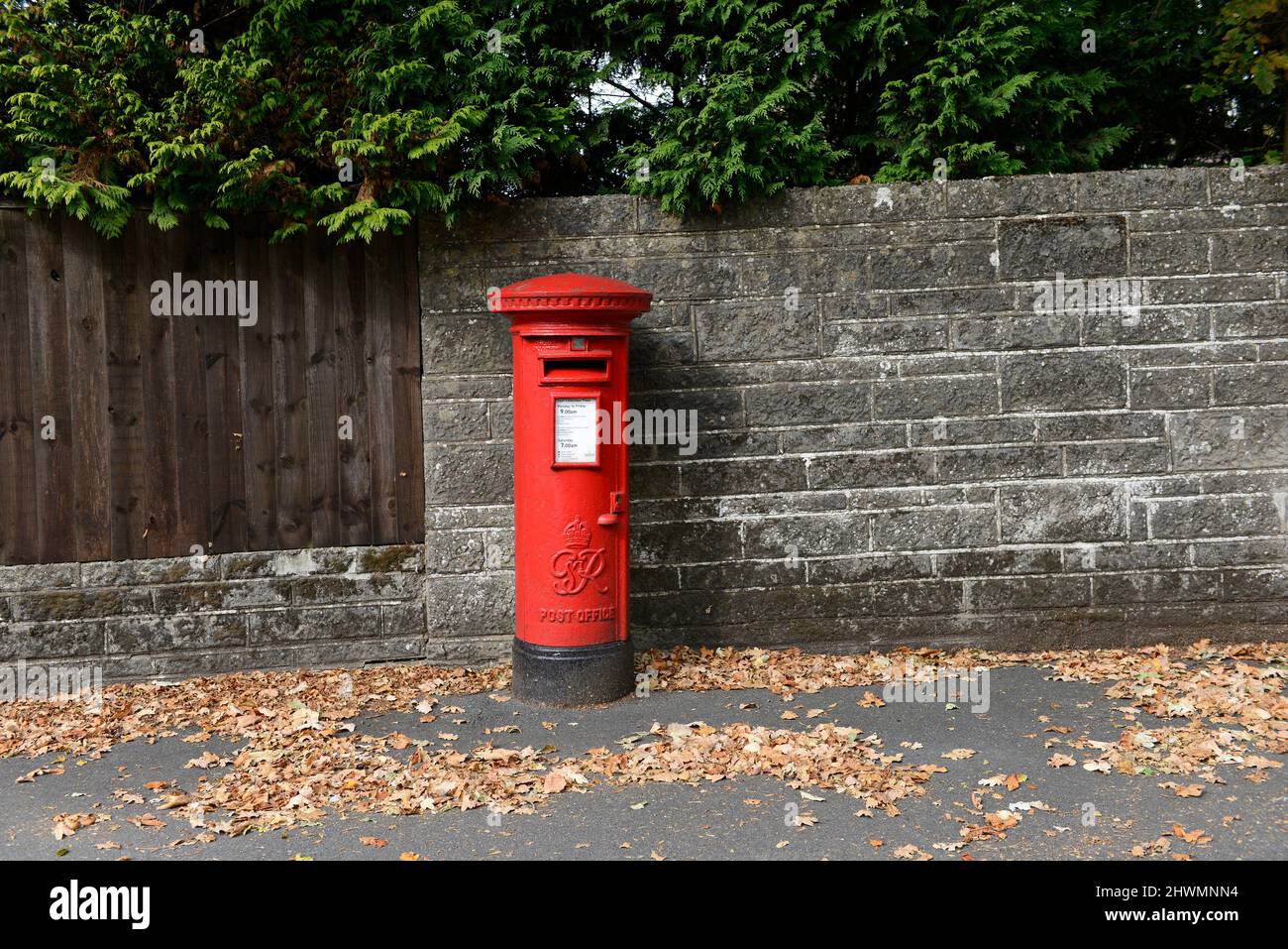A red letterbox on an inclined street in Fishbourne, Isle of Wight, UK ...
