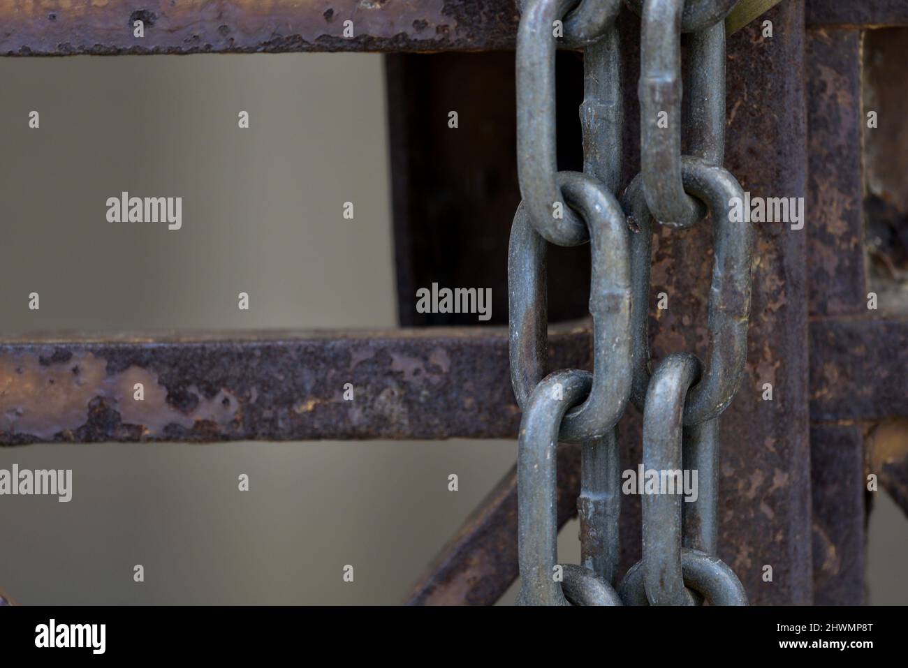 Old rusty iron metal entrance gate with a galvanized chain in Nafplio ...