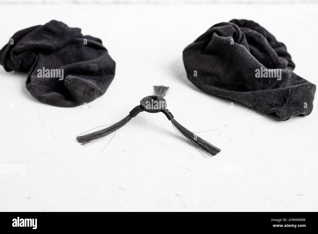 Dirty old socks and brush detail from a robotic vacuum cleaner ...