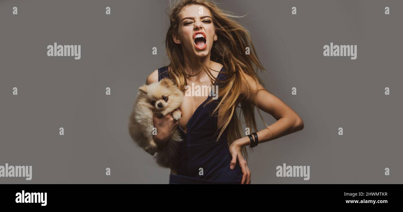 Young woman with pet dog screaming and shouting. Human emotions, facial ...