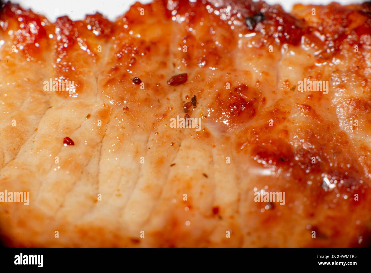 Texture of fried meat close up. A fatty piece of pork at a large ...