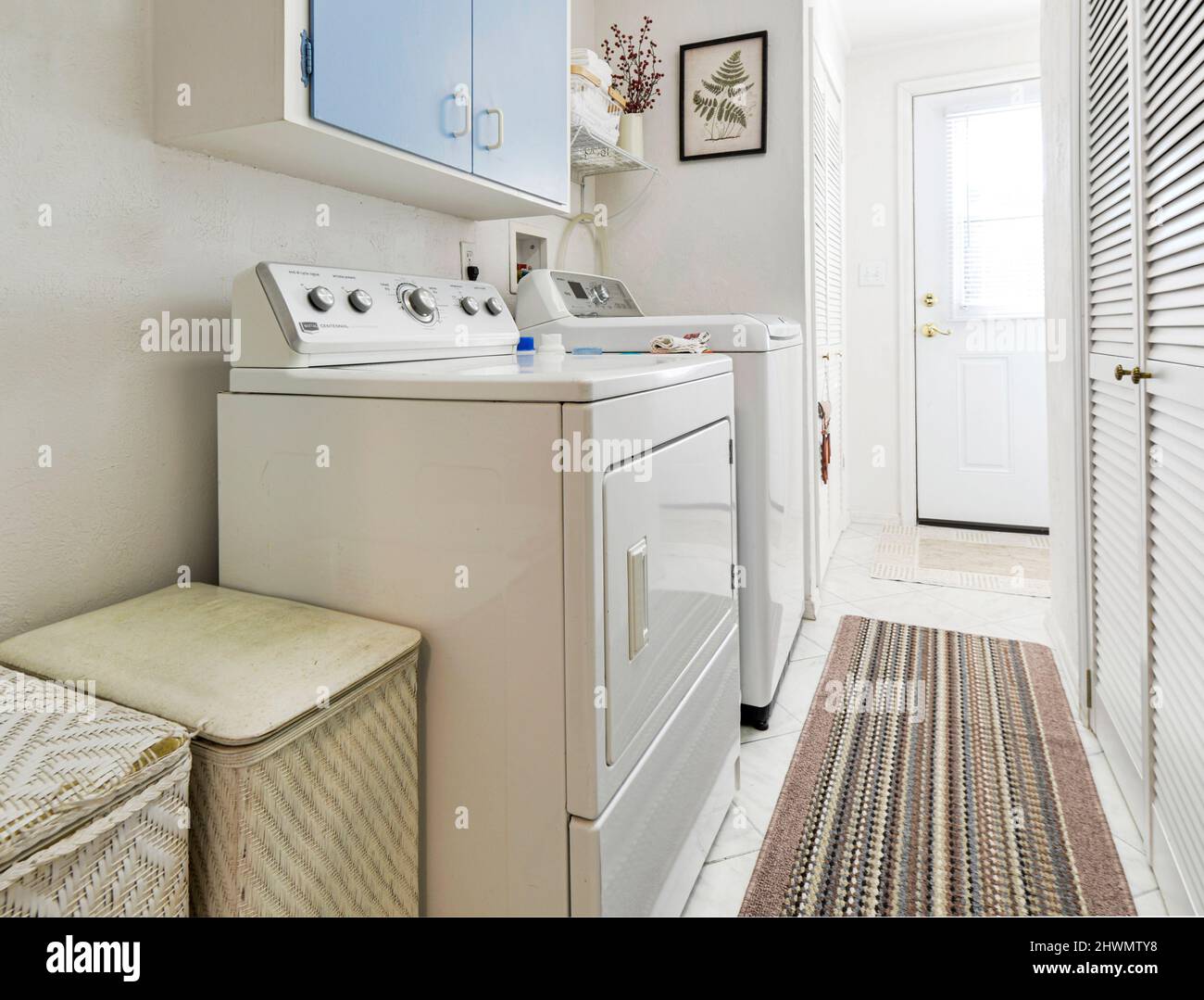 Modern residential laundry room interior Stock Photo - Alamy