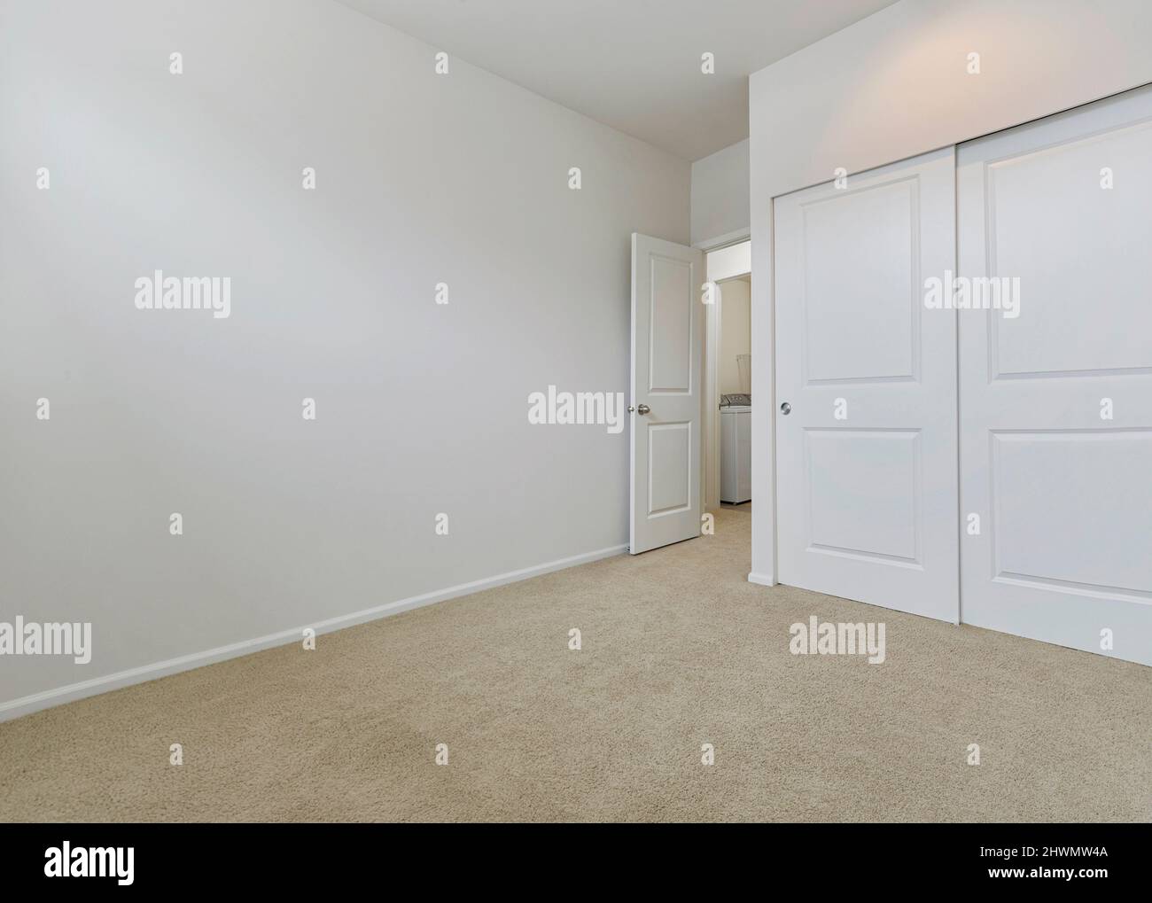 Modern residential empty bedroom interior Stock Photo - Alamy