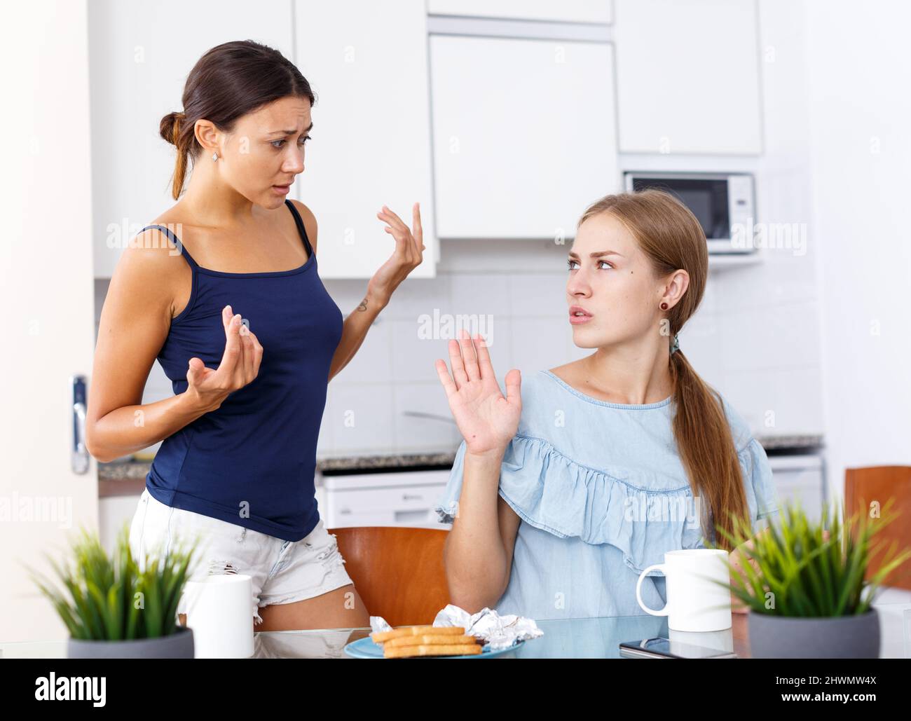 Portrait of two offended girls Stock Photo - Alamy