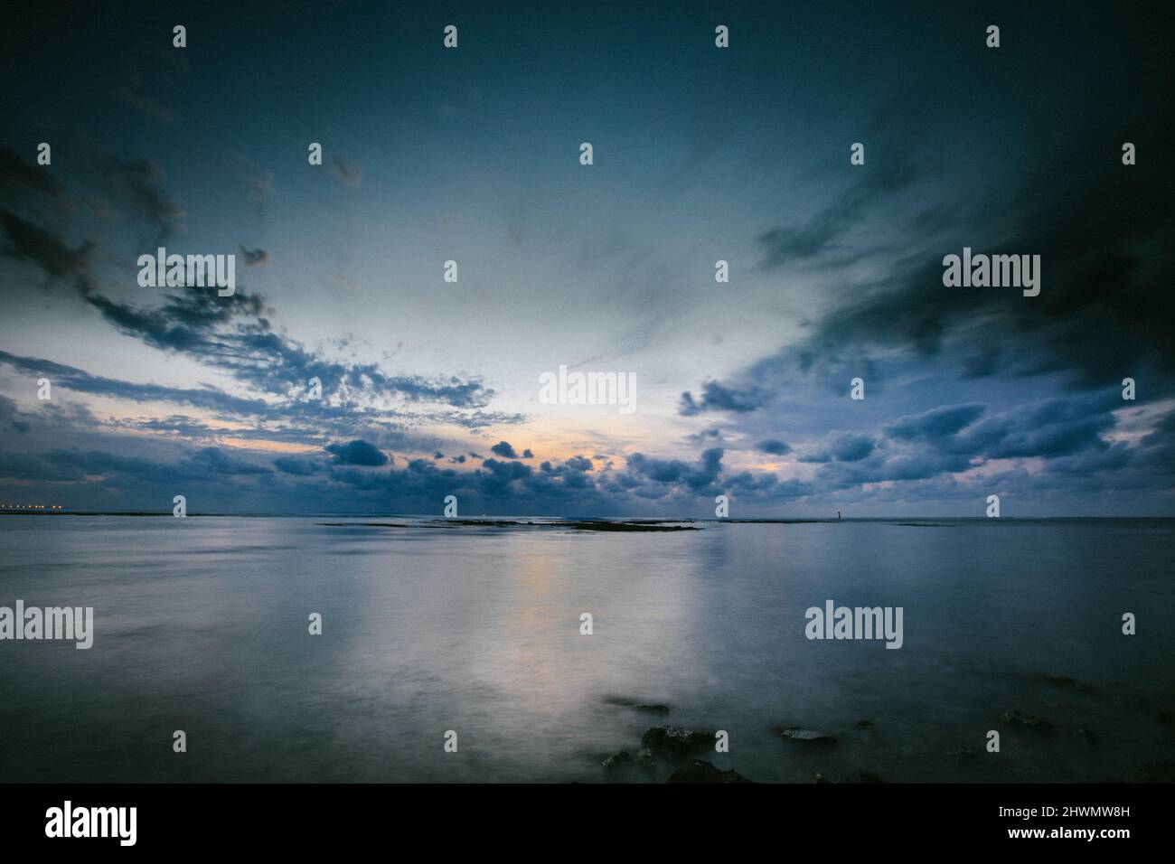 Blue ocean landscape right after sunset on tropical island Stock Photo ...