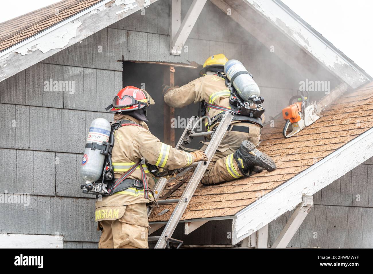 Firefighters work on extinguishing a structure fire Stock Photo - Alamy