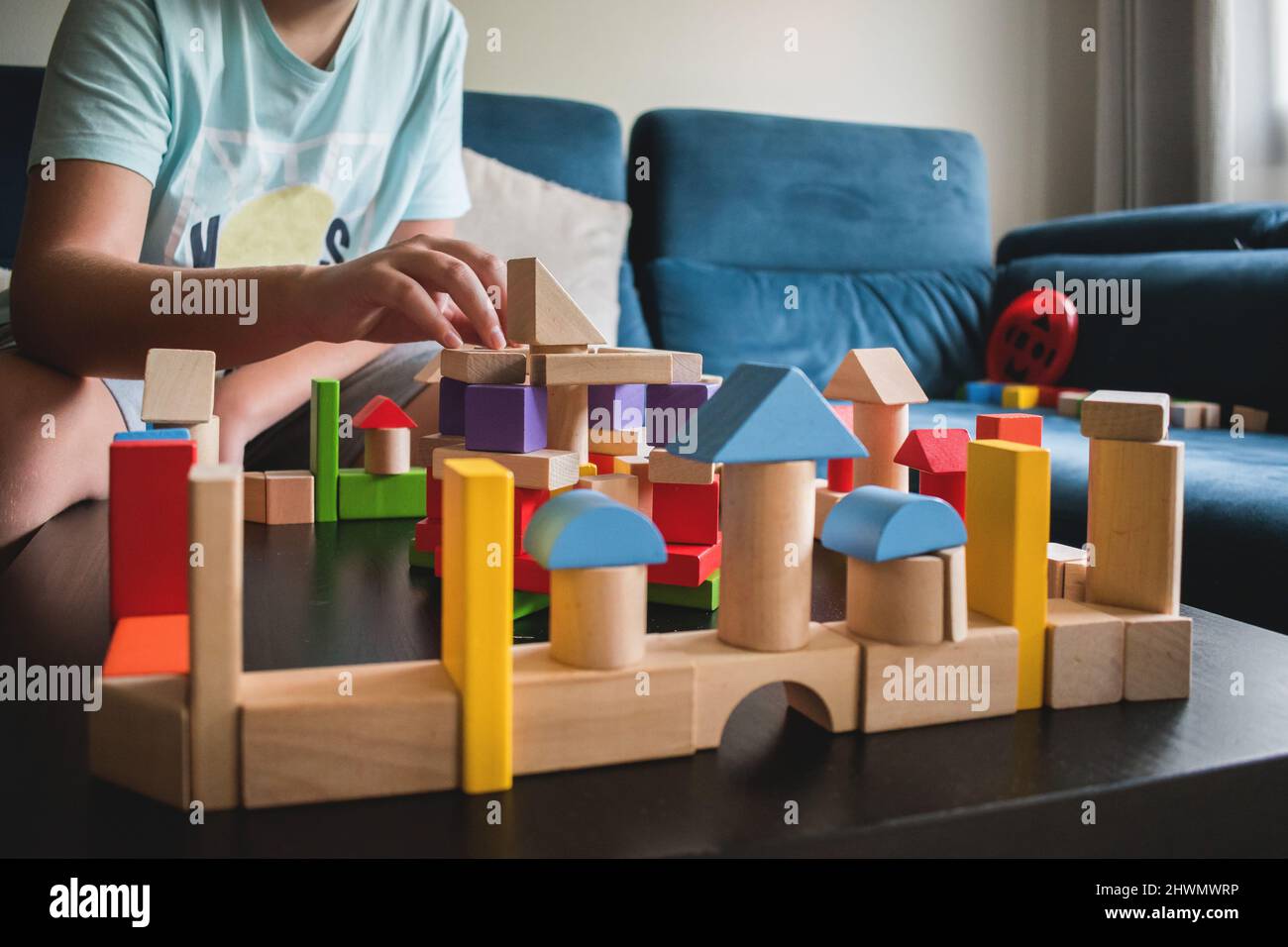 Boy playing with wooden blocks hi-res stock photography and images - Alamy