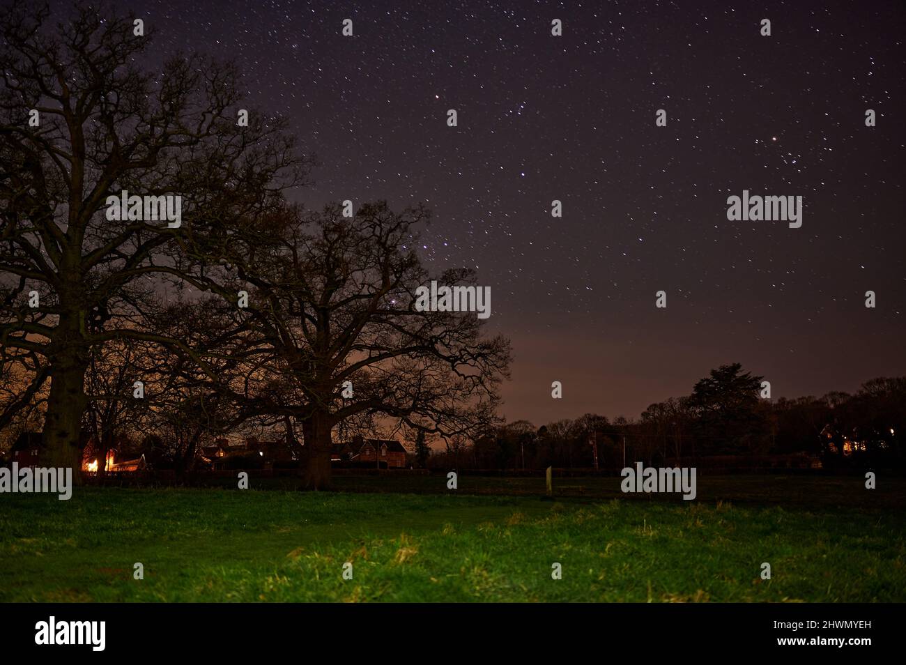Starry night over small houses in countryside Stock Photo - Alamy
