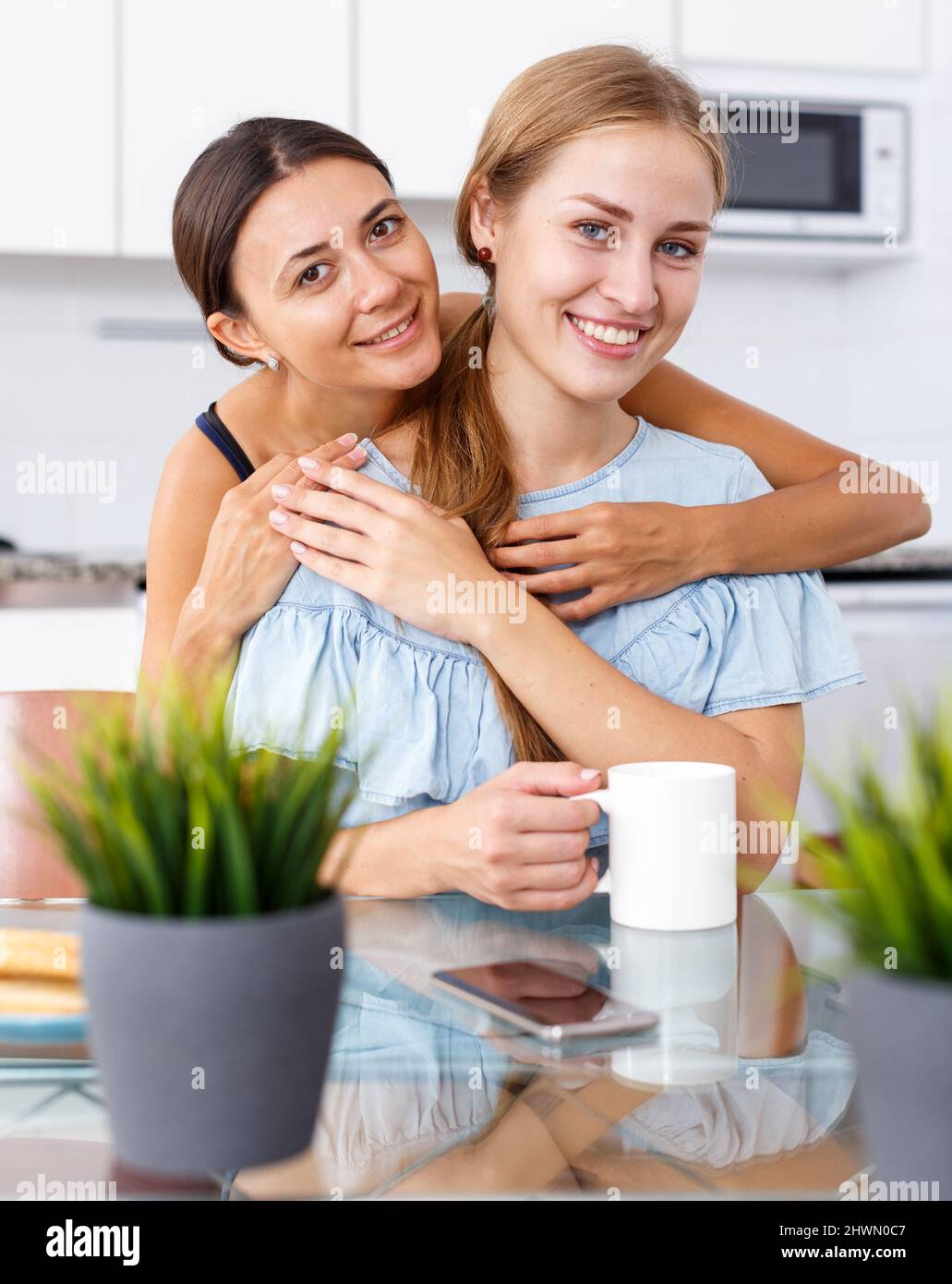 Two smiling girls friends in perfect mood Stock Photo - Alamy