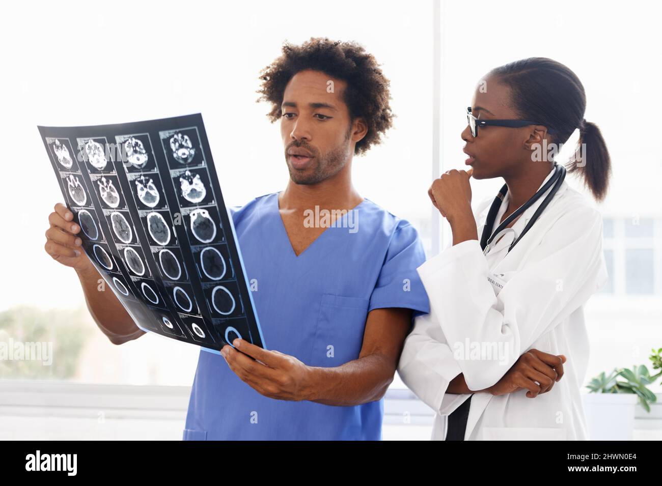 Learning how to read scans. Shot of a female doctor and male nurse ...