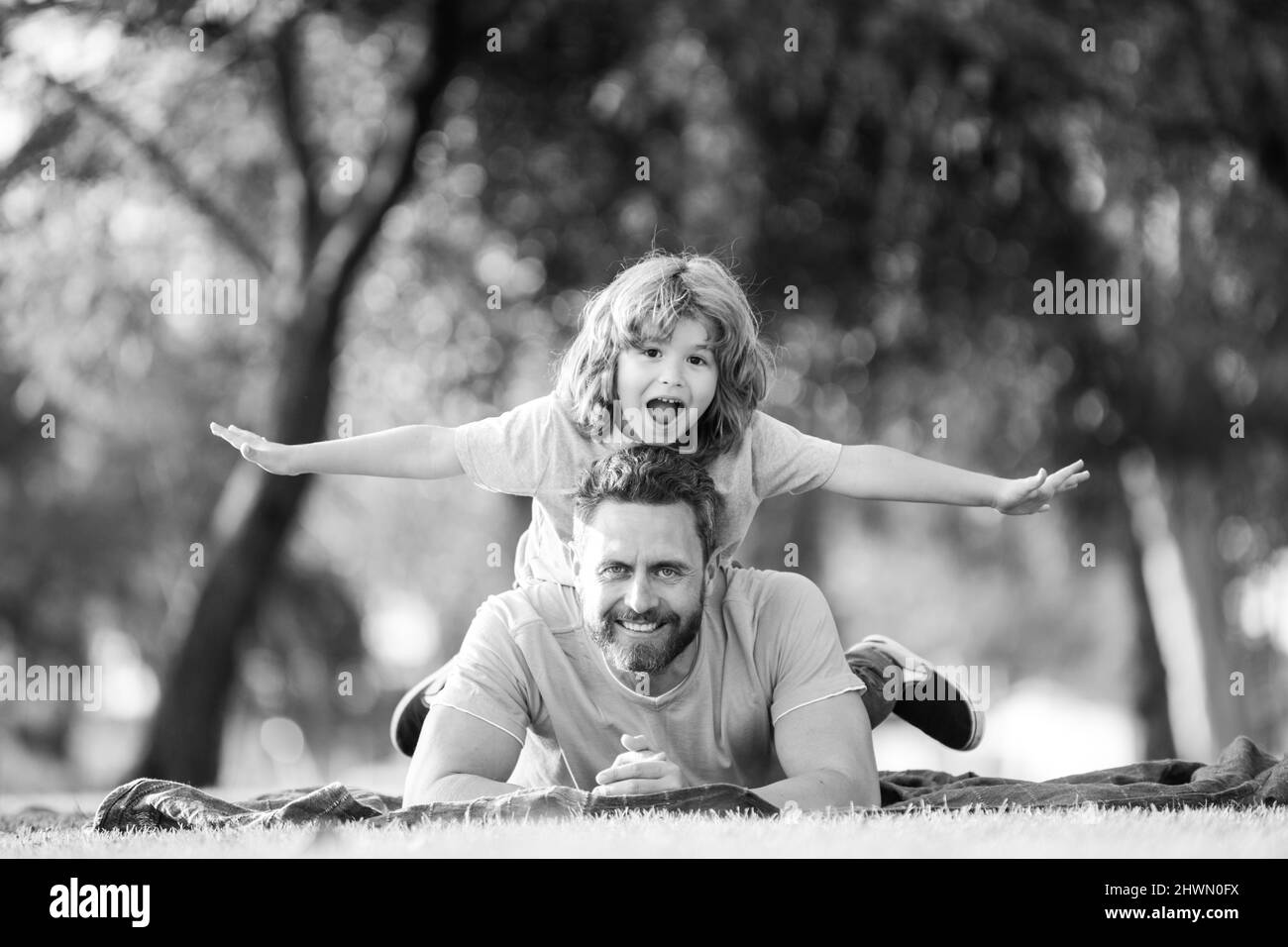 Father and son spending time outdoor together. Happy men family concept ...