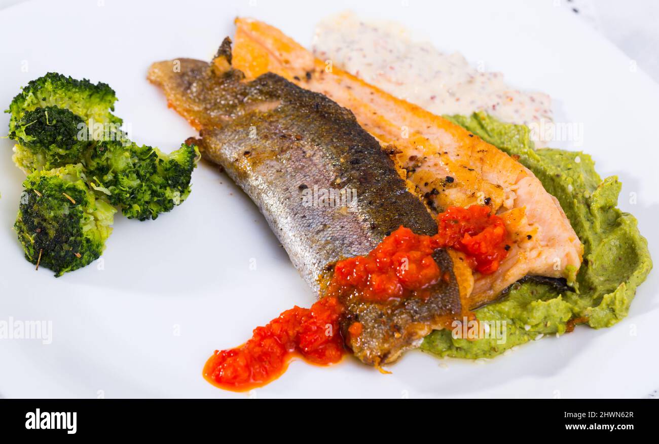 Tasty steak of fried river trout fillet with broccoli and sause tartar ...