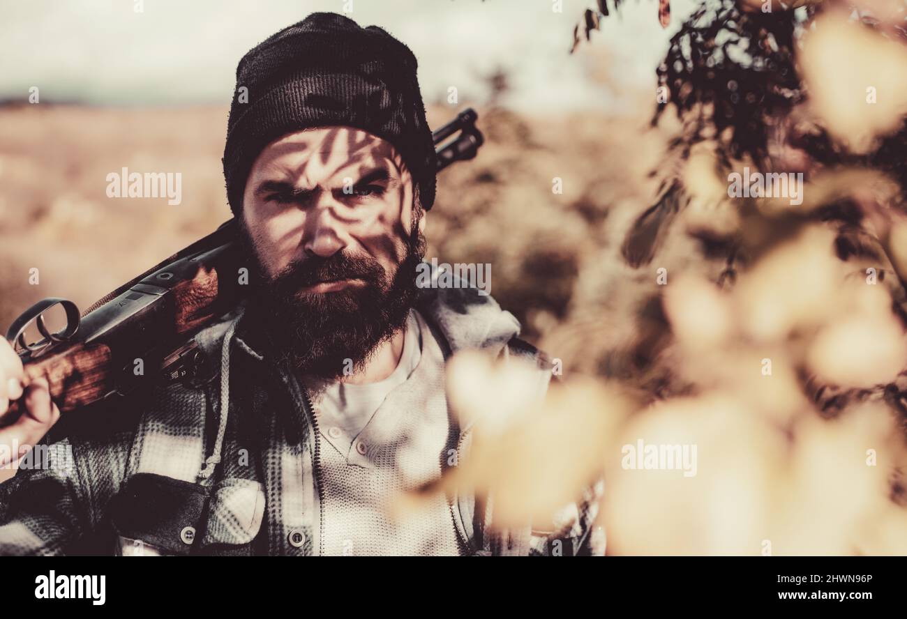 Hunter with shotgun gun on hunt. Close up Portrait of hamdsome Hunter ...