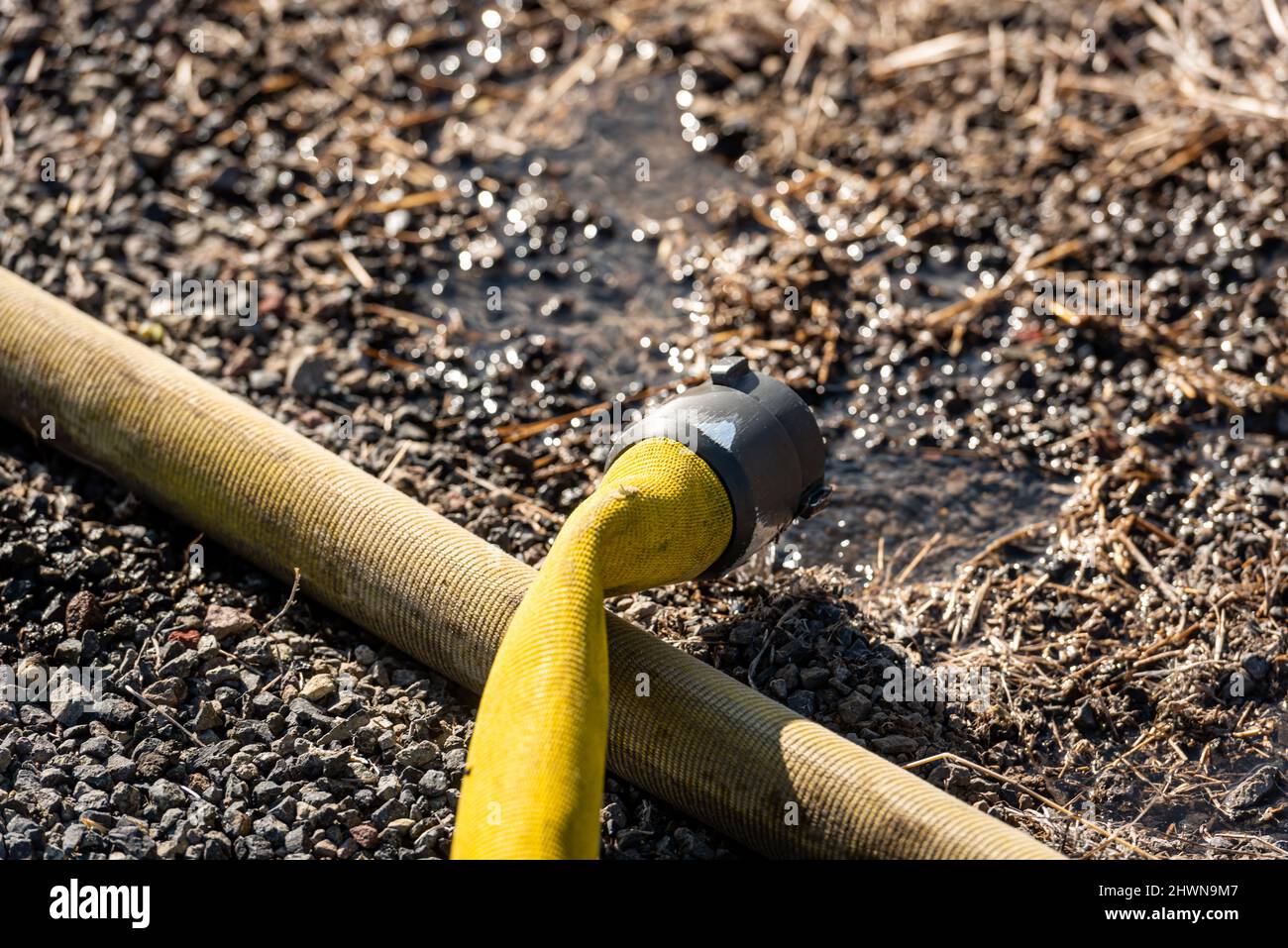 Fire host coupling drains on the ground Stock Photo - Alamy