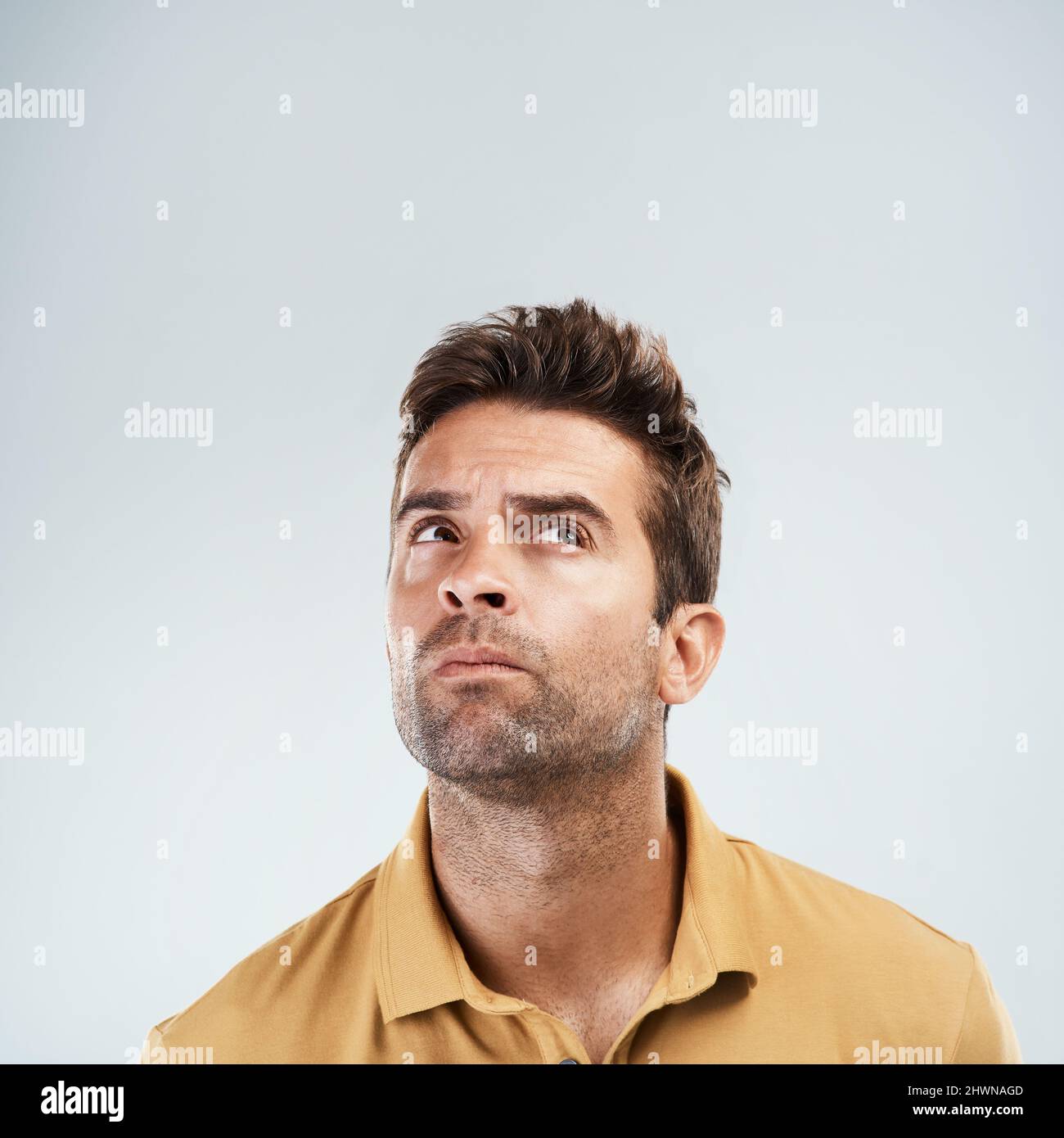 My head is in a world of wonder. Studio shot of a young man with a ...