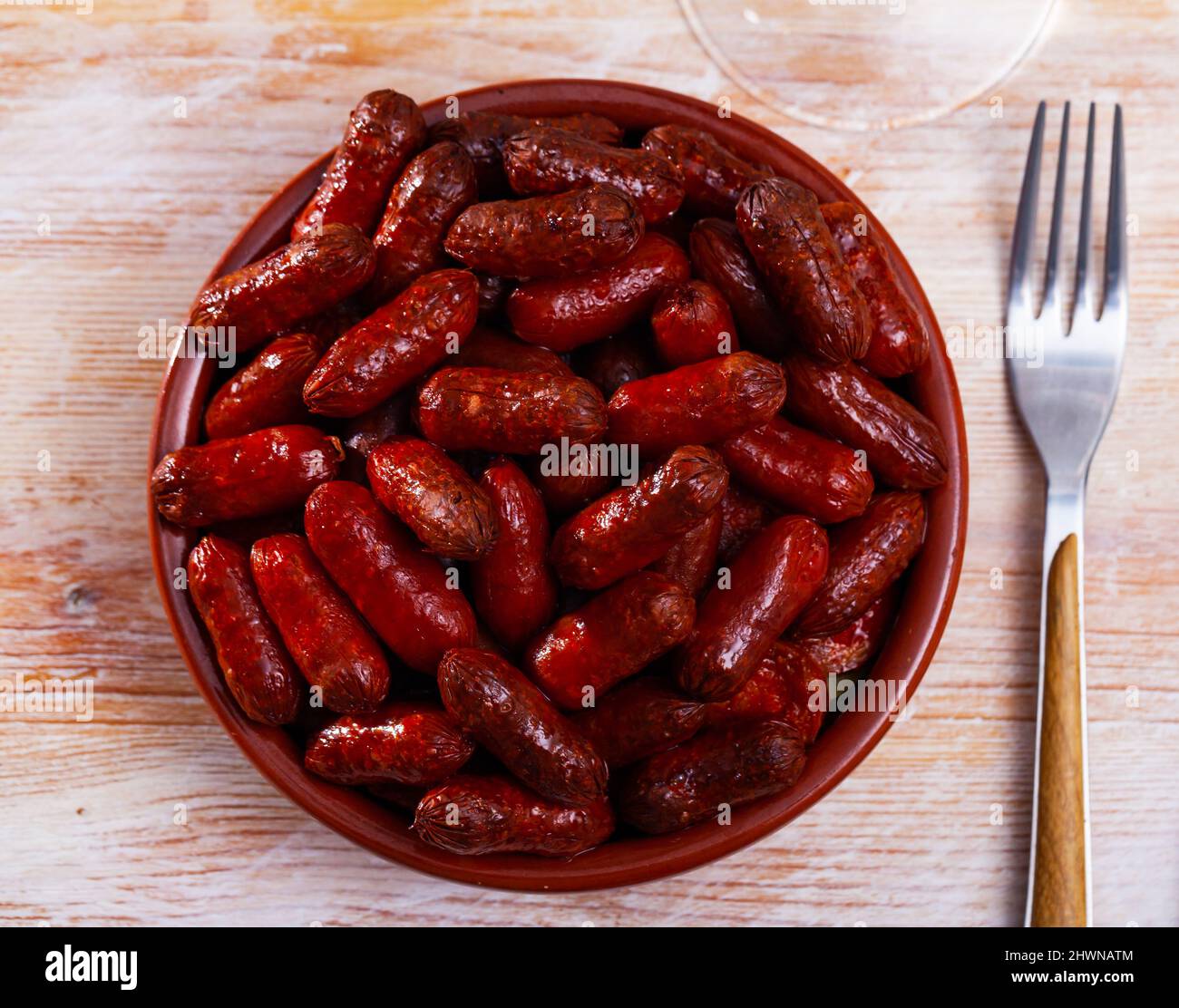 Roasted small chorizo sausages Stock Photo - Alamy