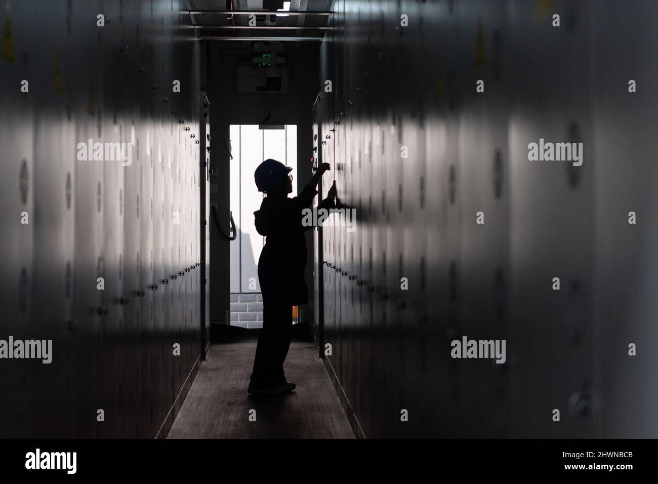 A staff member checks the storage battery warehouse at jiangbei Energy ...