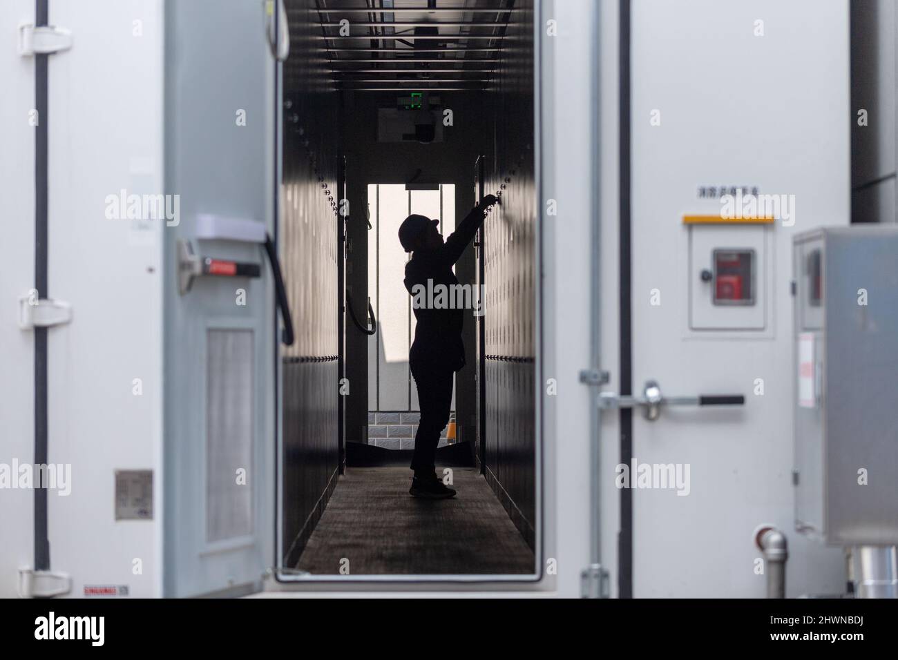 A staff member checks the storage battery warehouse at jiangbei Energy ...