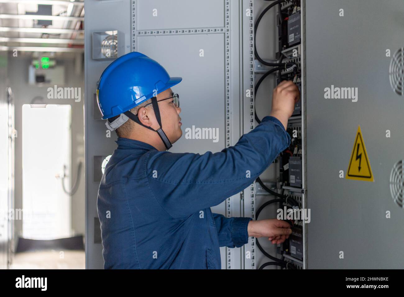 A staff member checks the storage battery warehouse at jiangbei Energy ...