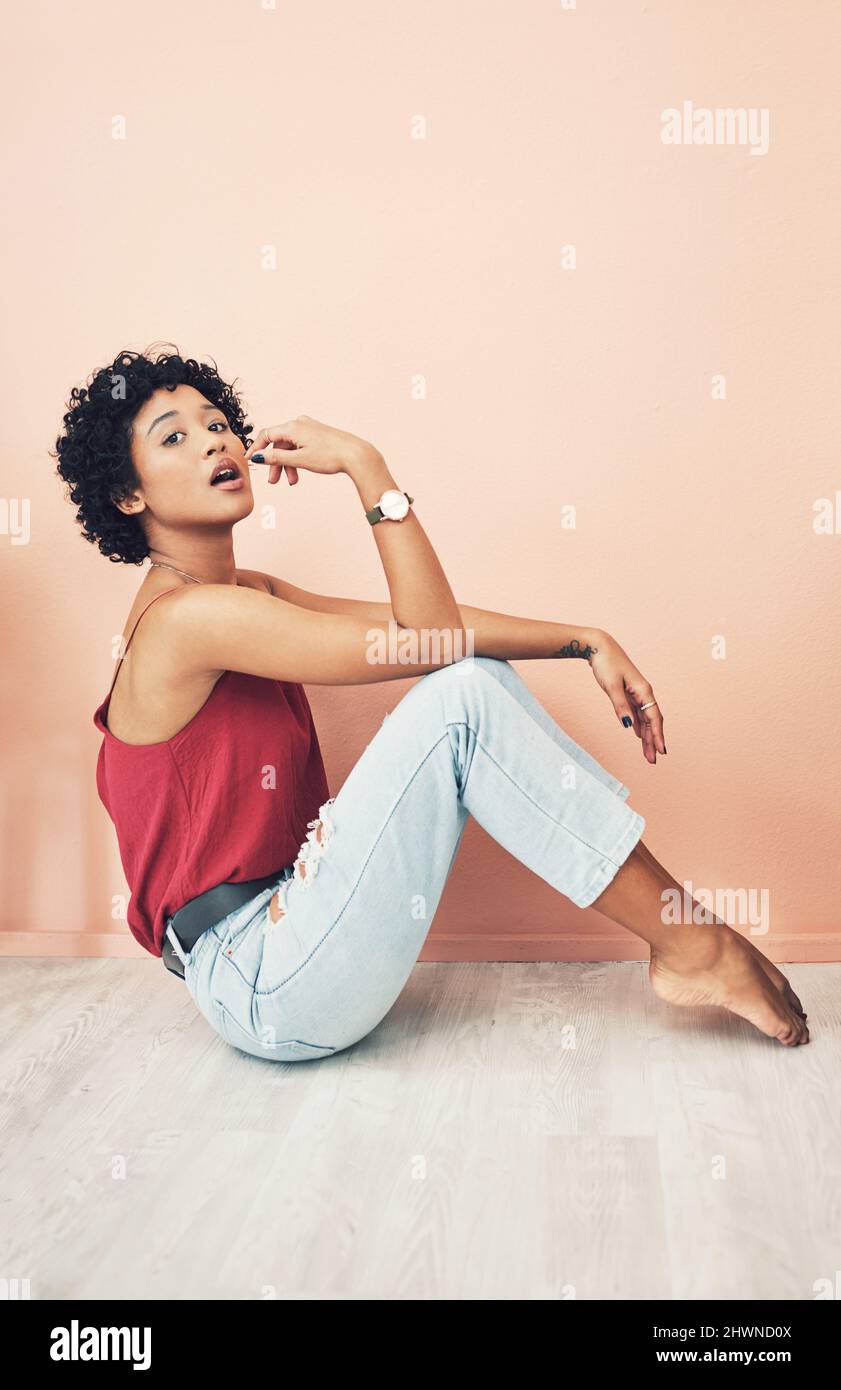 Im a savage. Shot of a beautiful young woman striking a pose while ...