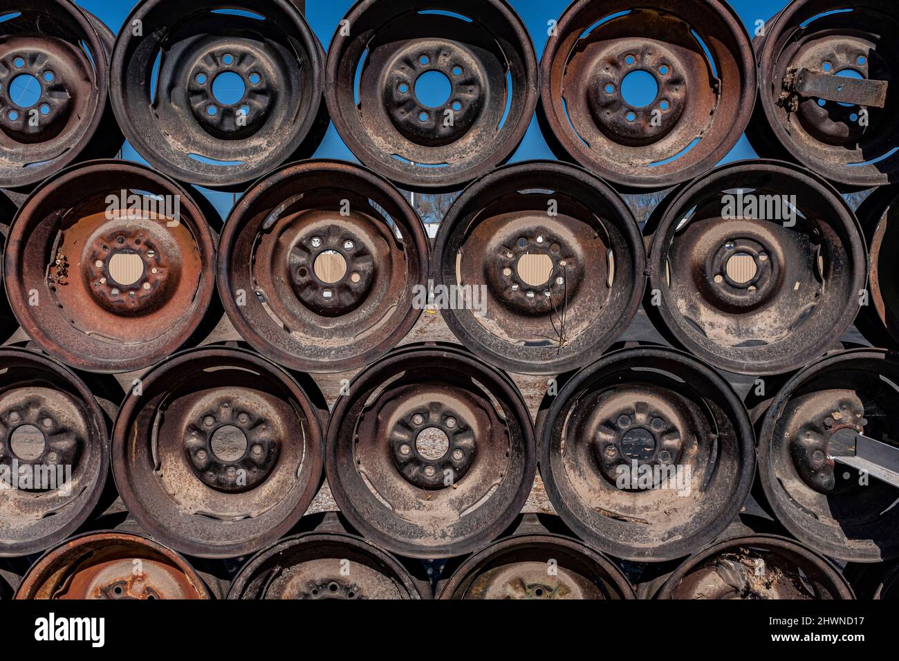 rusted rims welded and stacked vertical Stock Photo - Alamy