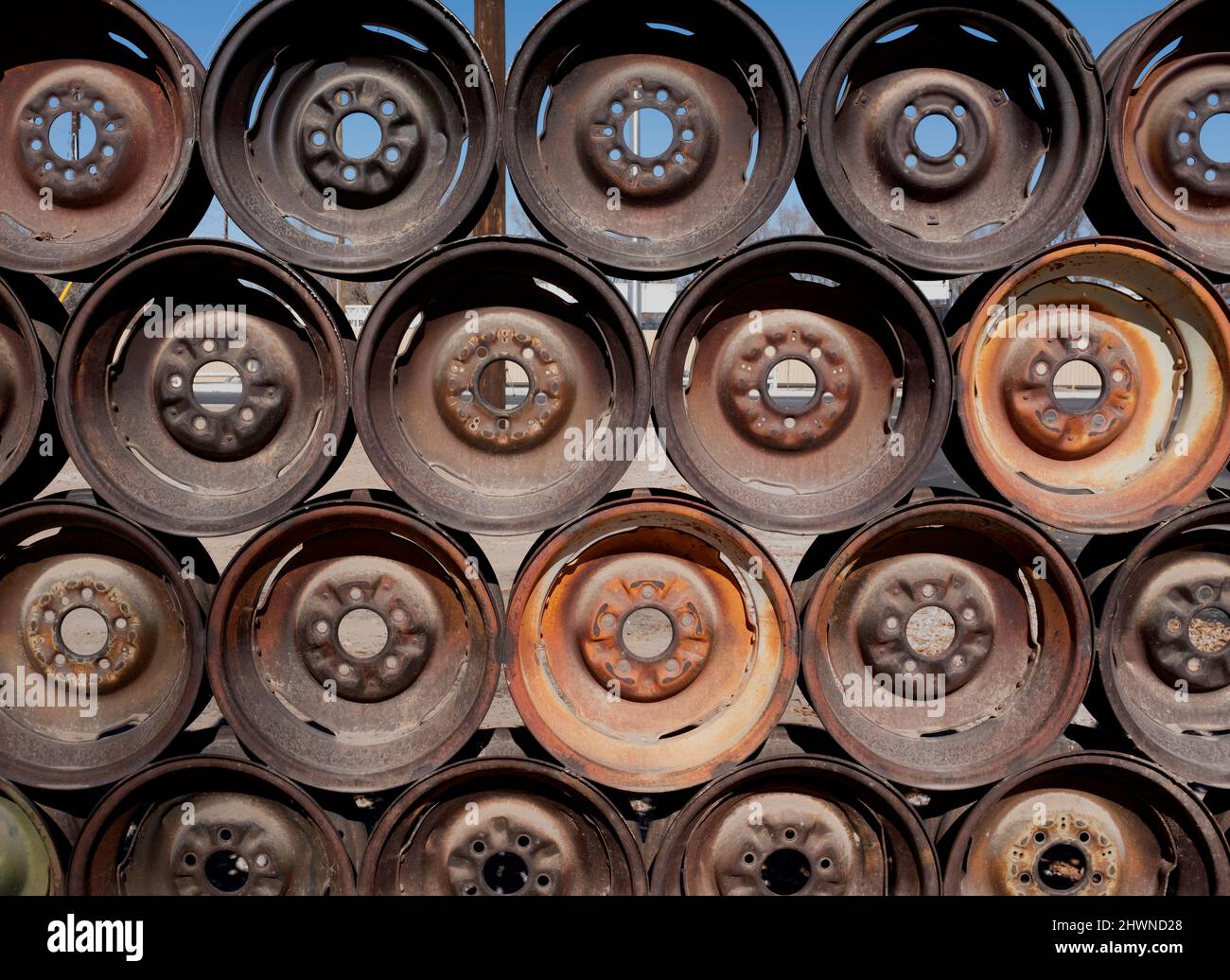 rusted rims welded and stacked vertical Stock Photo - Alamy